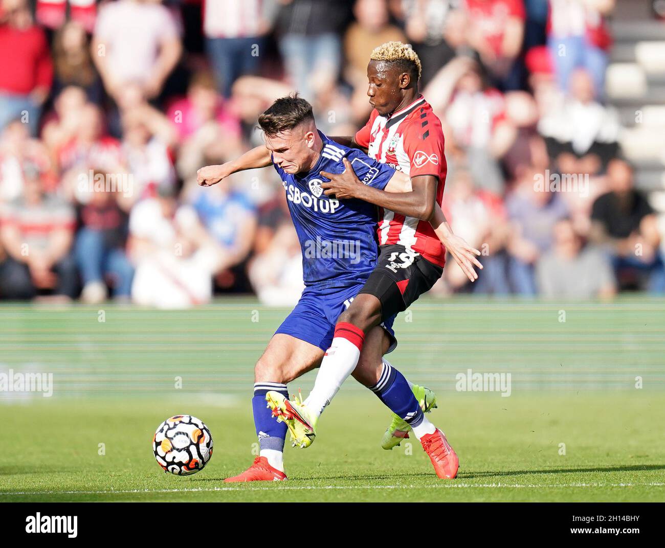 Leeds United's Jamie Shackleton (left) and Southampton's Moussa Djenepo ...