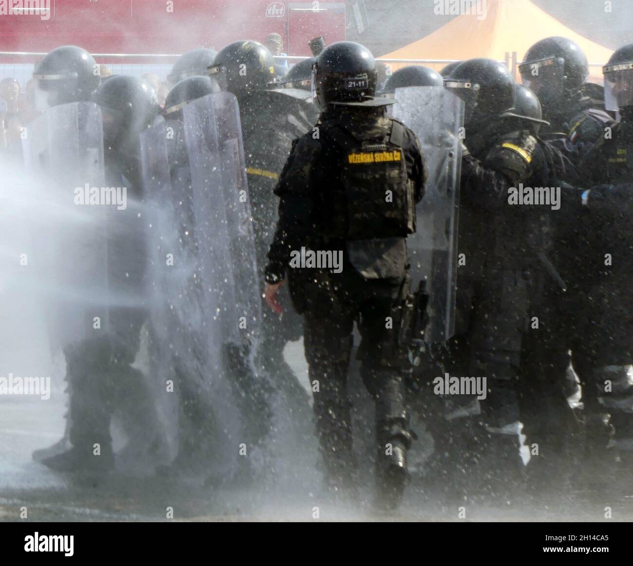 Selective of a group of policemen with shields during a riot Stock ...