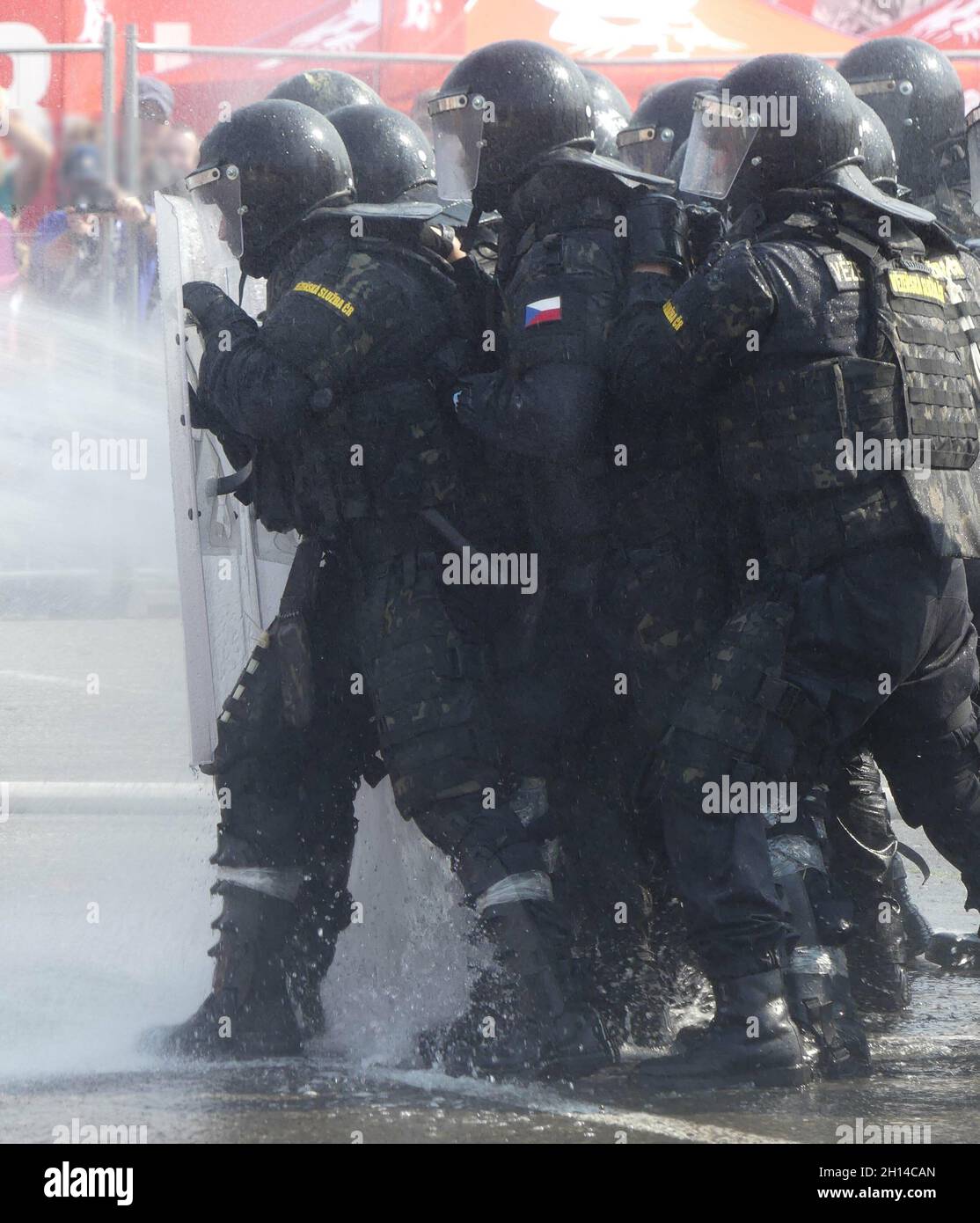 Selective of a group of policemen with shields during a riot Stock ...