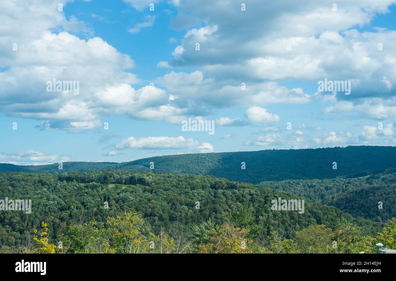 Clouds float over rolling green hills in rural Pennsylvania, USA.fluffy ...