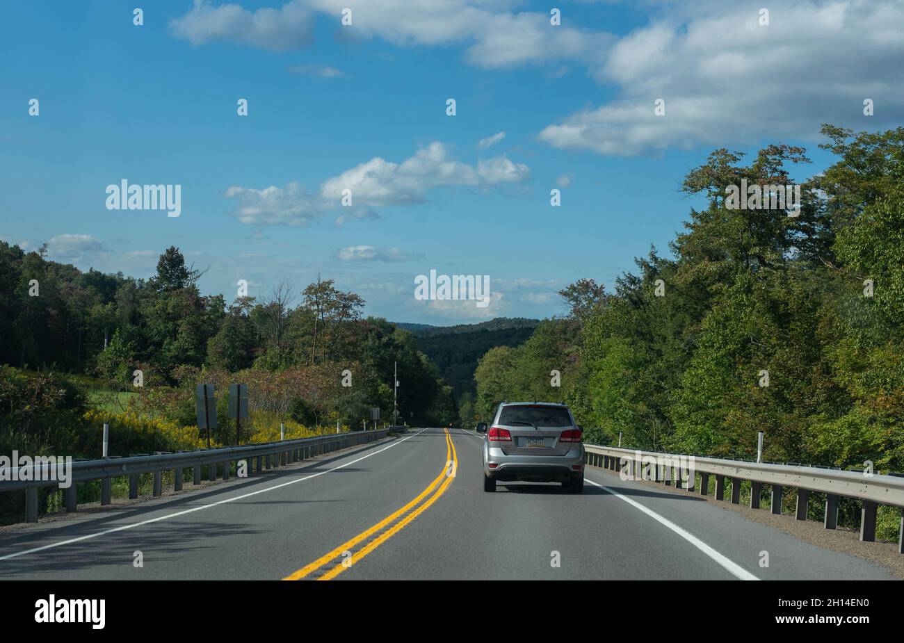 A view of a highway in rural America with cars traveling on it Stock ...