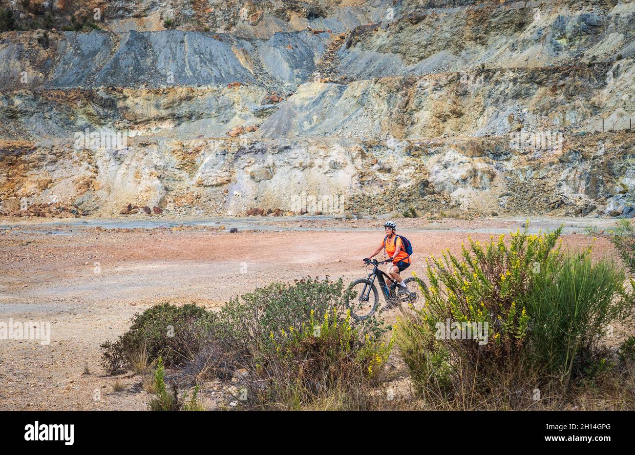 nice active woman riding her electric mountain bike in the abandoned ...