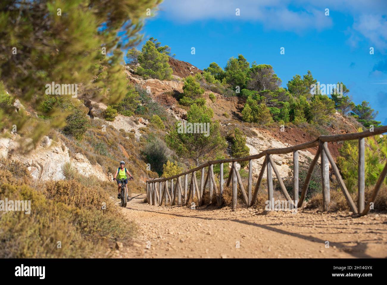 nice active woman riding her electric mountain bike in the abandoned ...