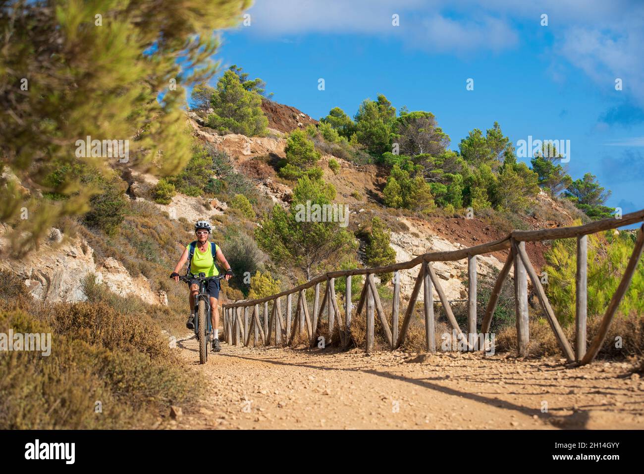 nice active woman riding her electric mountain bike in the abandoned ...
