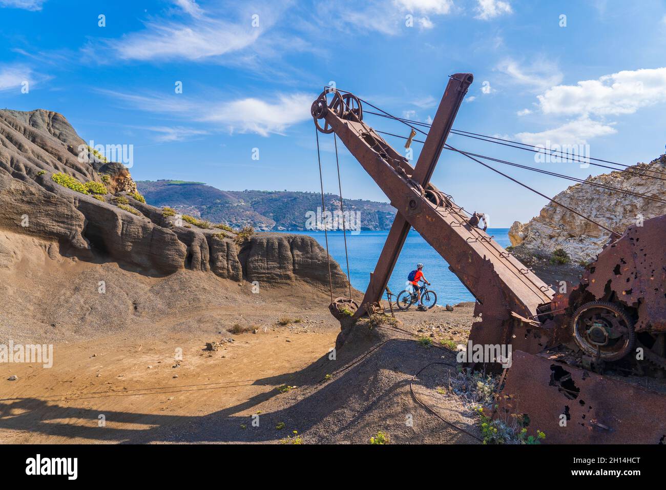 nice active woman riding her electric mountain bike in the abandoned ...