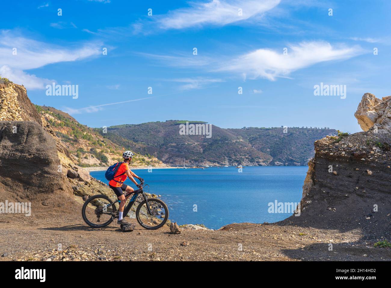 nice active woman riding her electric mountain bike in the abandoned ...