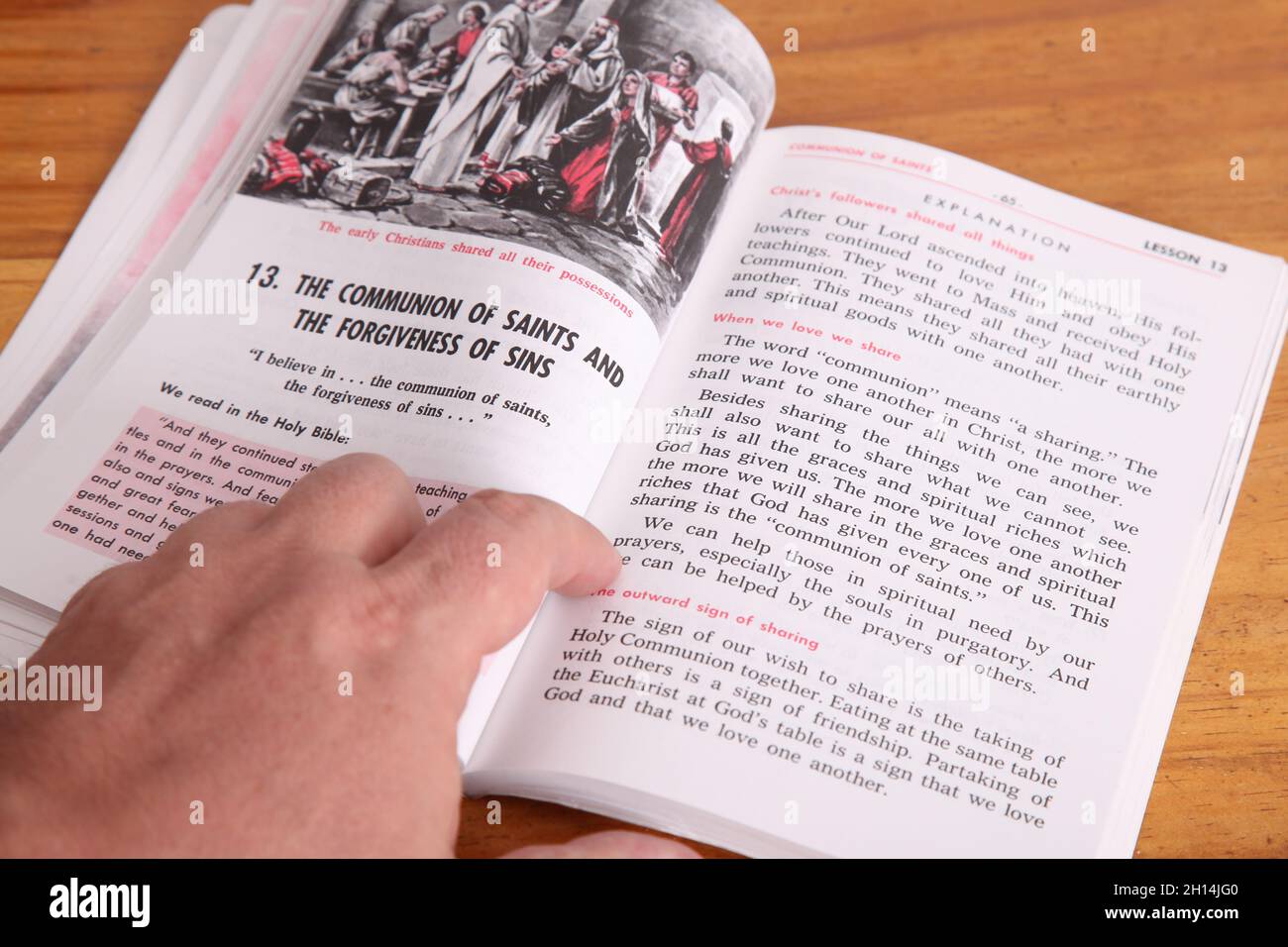 Man reading 'The Communion of Saints and Forgiveness of Sins' Baltimore ...