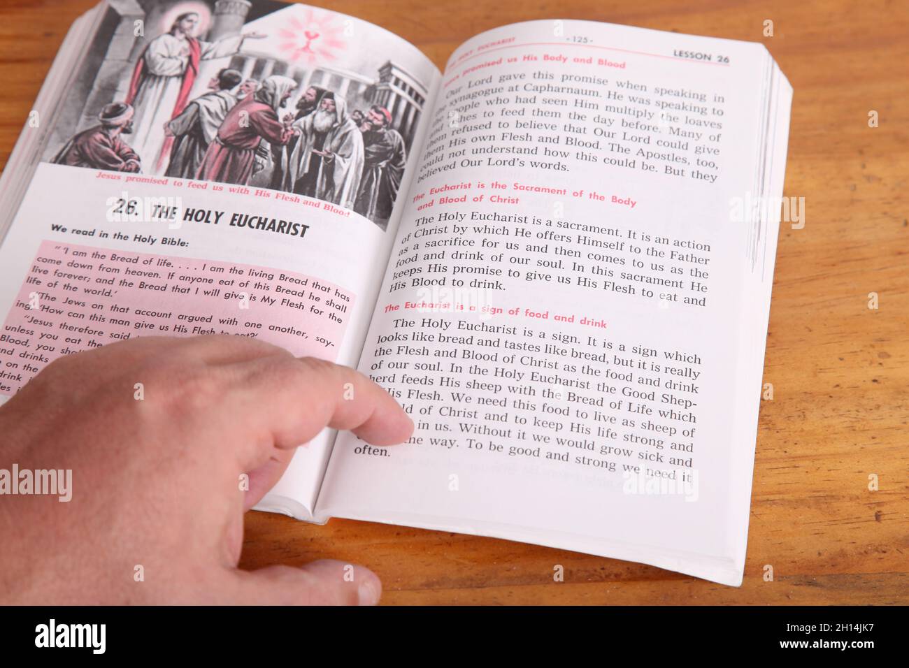Man reading 'The Holy Eucharist' Baltimore Catechism by Father Bennett ...