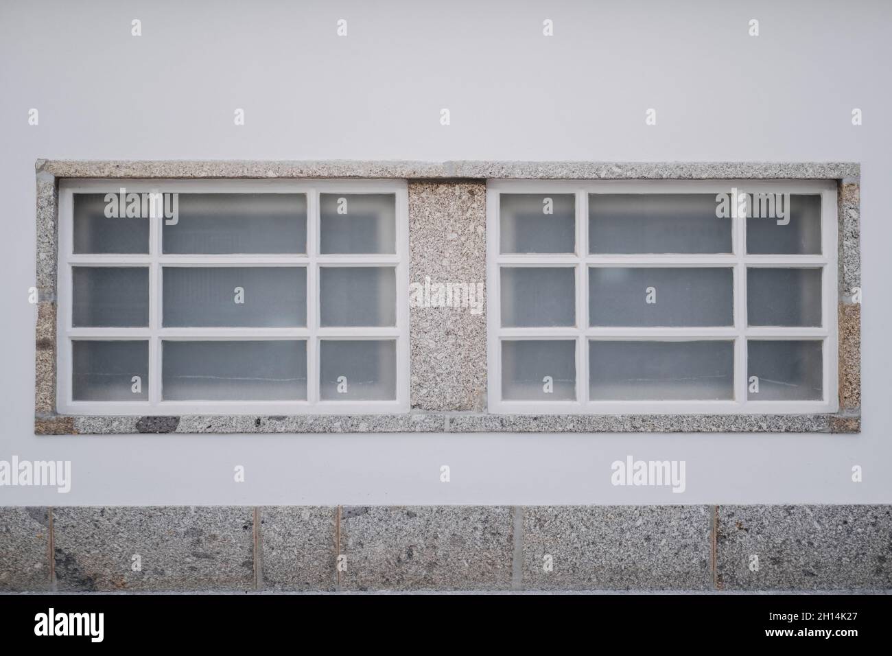 Closeup shot of long windows with white bars Stock Photo - Alamy