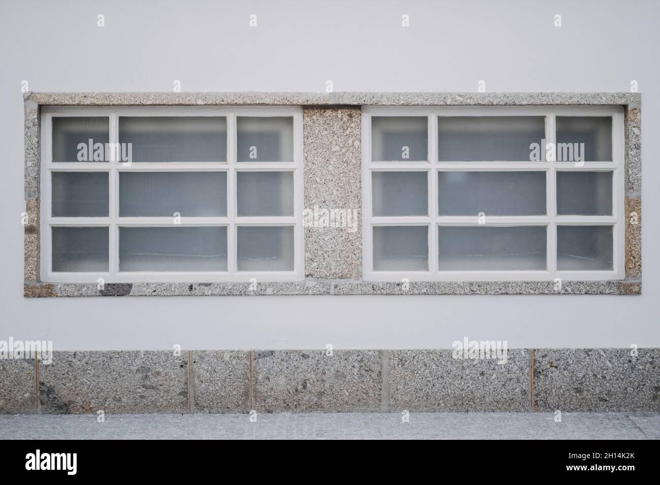 Closeup shot of long windows with white bars Stock Photo - Alamy
