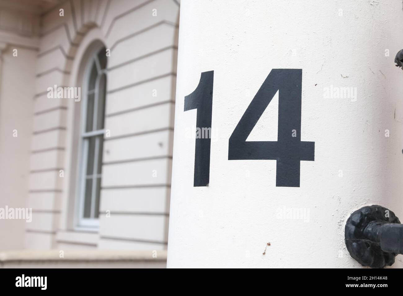 Door Number 14 on white pillar outside house in Belgravia, London ...