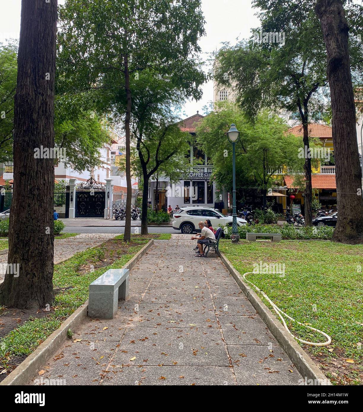 Saigon, Vietnam - Oct 3, 2021. Road with many trees in downtown Saigon ...