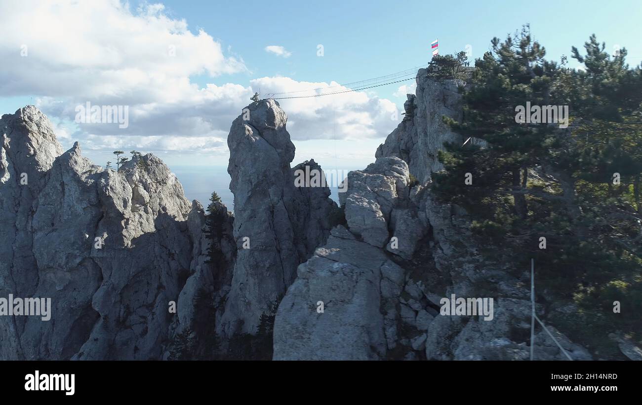 Group of people standing on top of a mountain. They set the national ...