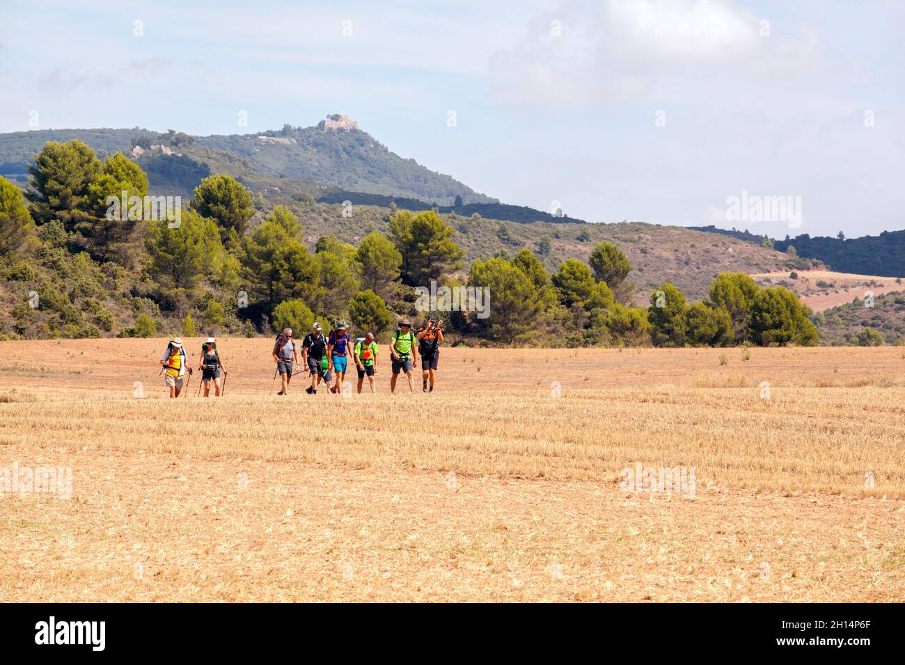 Group of Pilgrims walking through the Spanish countryside between ...