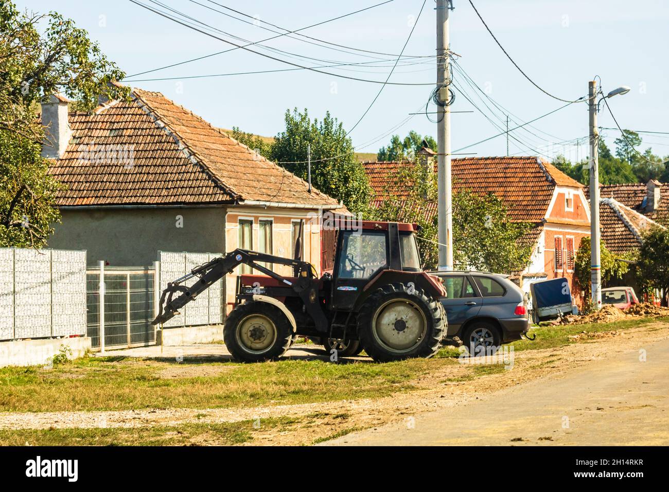 Agricultural tractor on road in Viscri, Romania, 2021 Stock Photo - Alamy