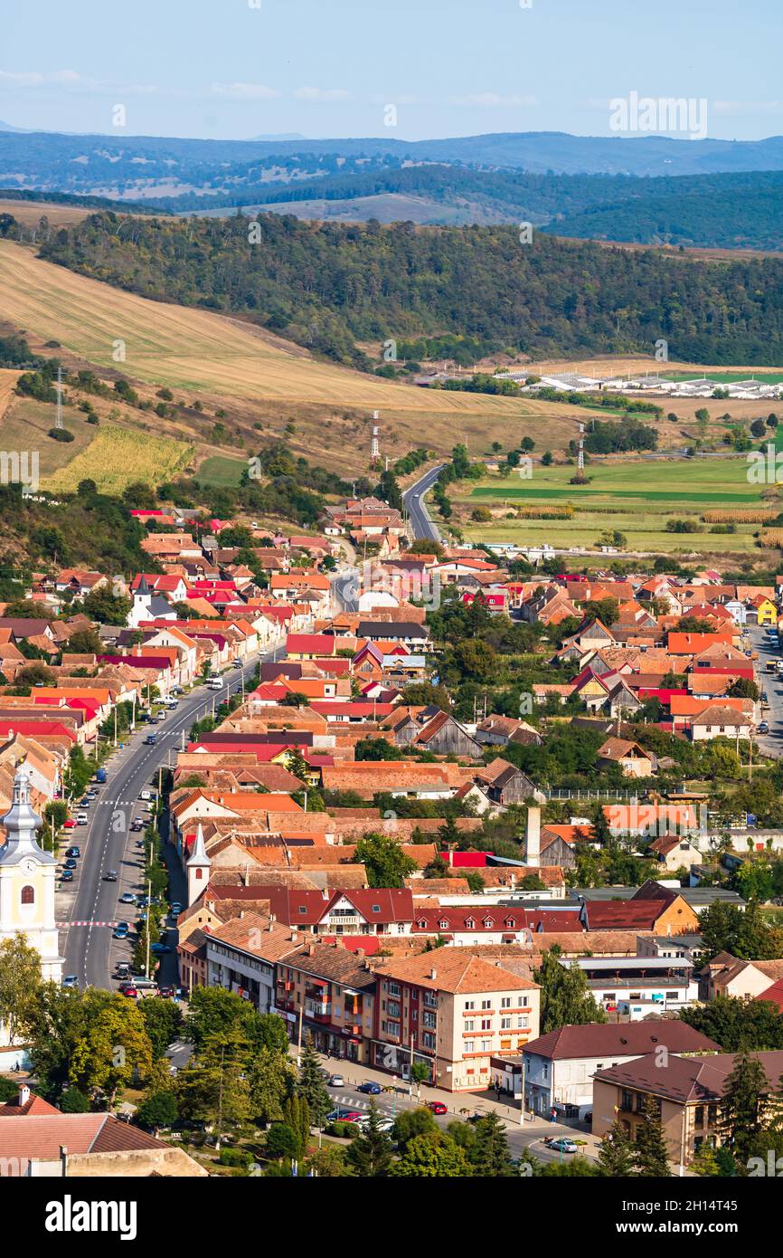 Aerial view of the town center with hills, buildings, streets ...