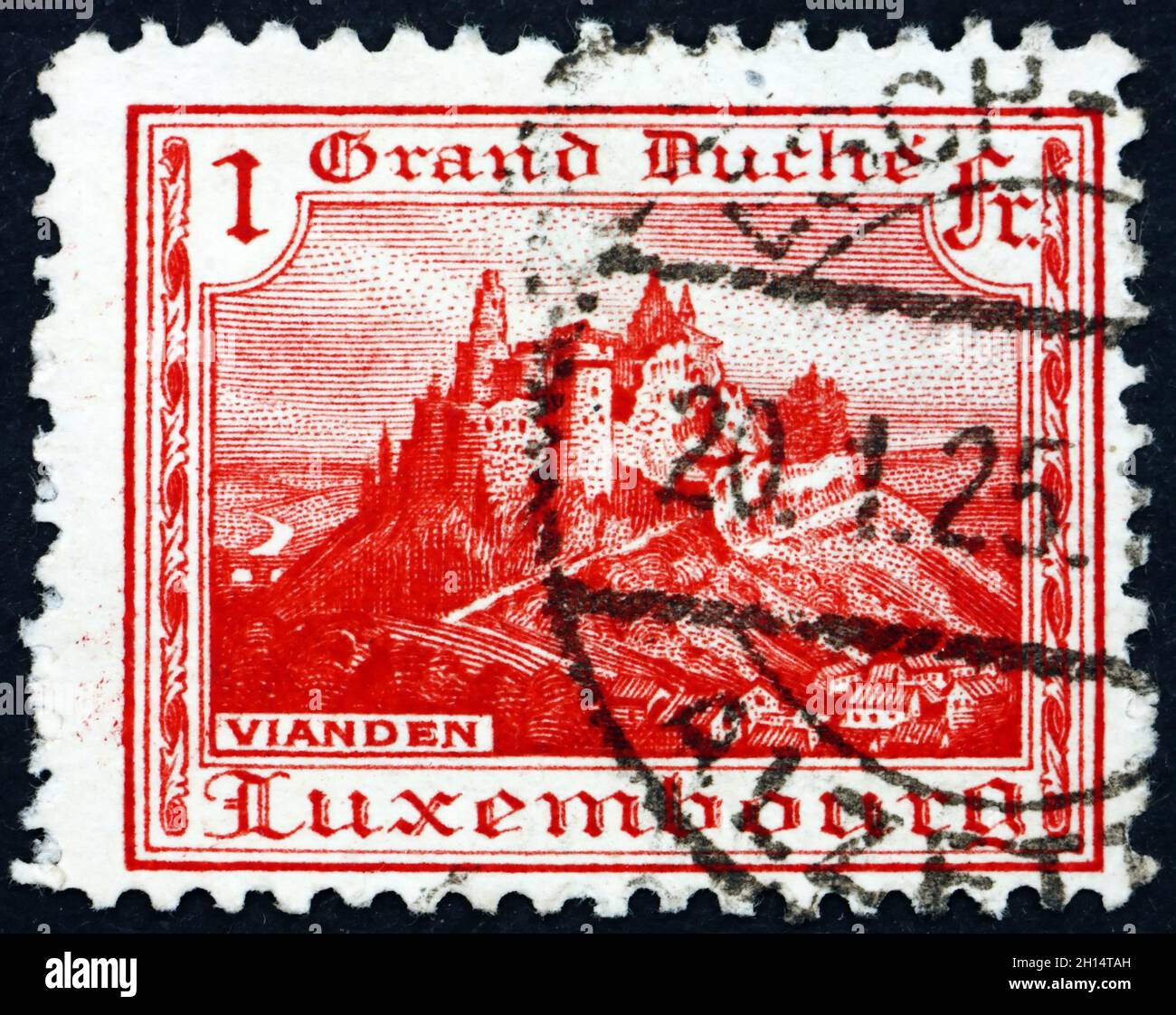 LUXEMBOURG - CIRCA 1921: a stamp printed in Luxembourg shows Vianden ...