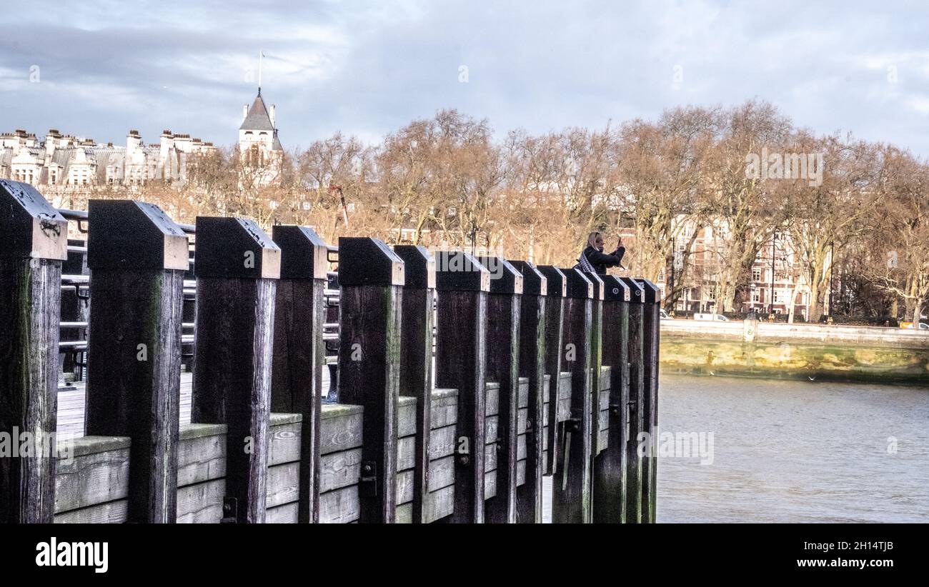 woman walking along peer on the south bank London Stock Photo - Alamy