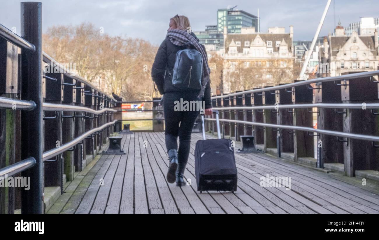 woman walking along peer on the south bank London Stock Photo - Alamy