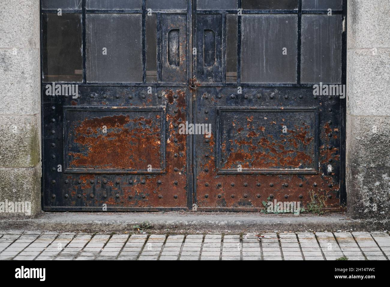 Rusty black abandoned door surface Stock Photo - Alamy