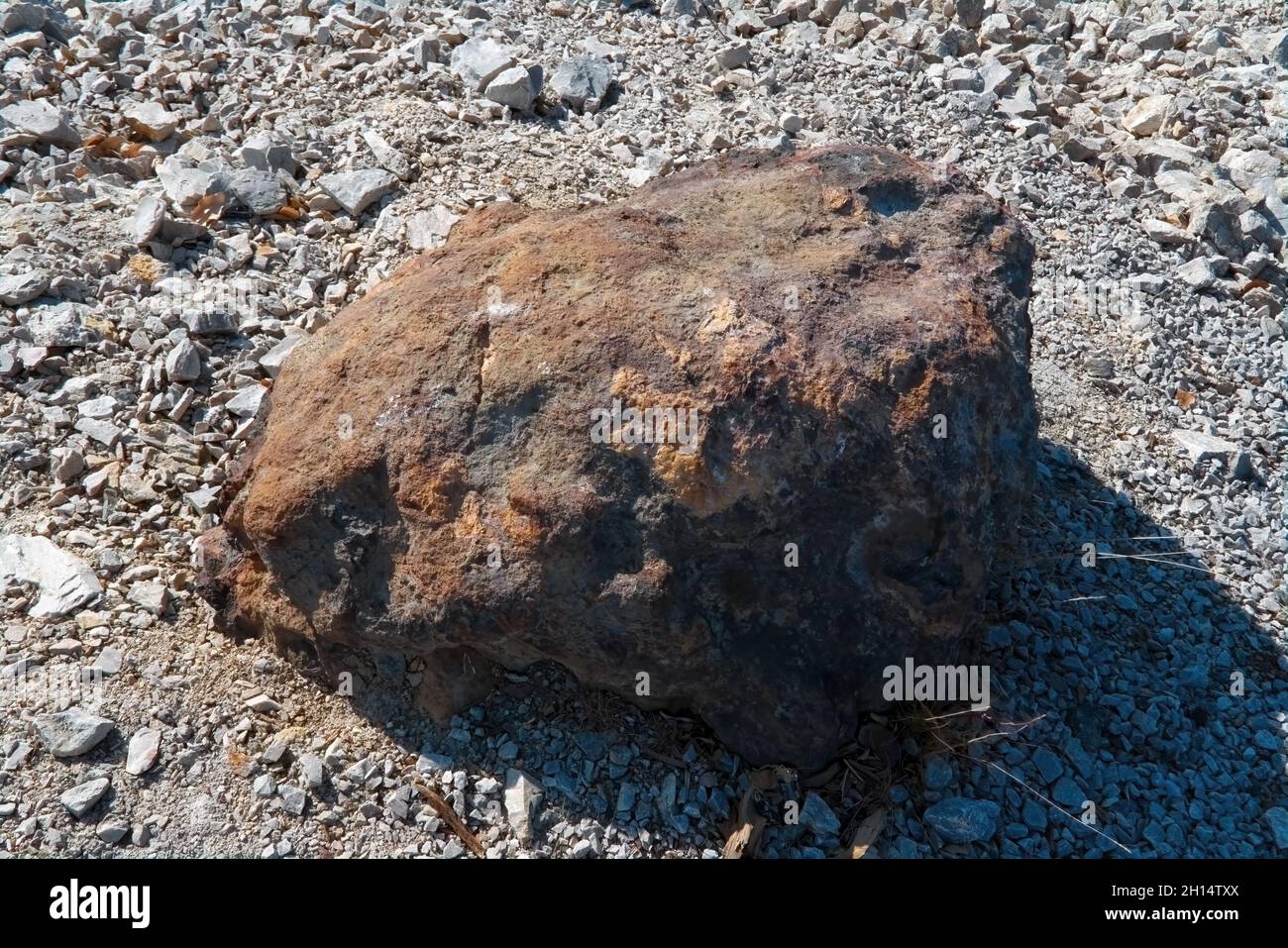 iron ore lies on the surface of the earth near the mine Stock Photo - Alamy