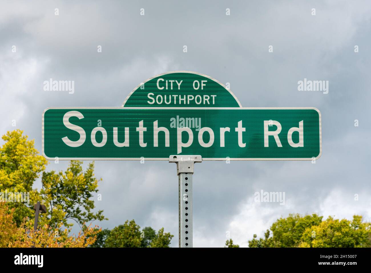 A green road sign marks Southport Rd in the City of Southport, Indiana ...
