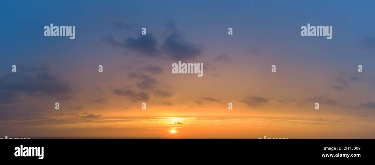 Sunset panorama with blurred colorful sky and orange sun Stock Photo ...