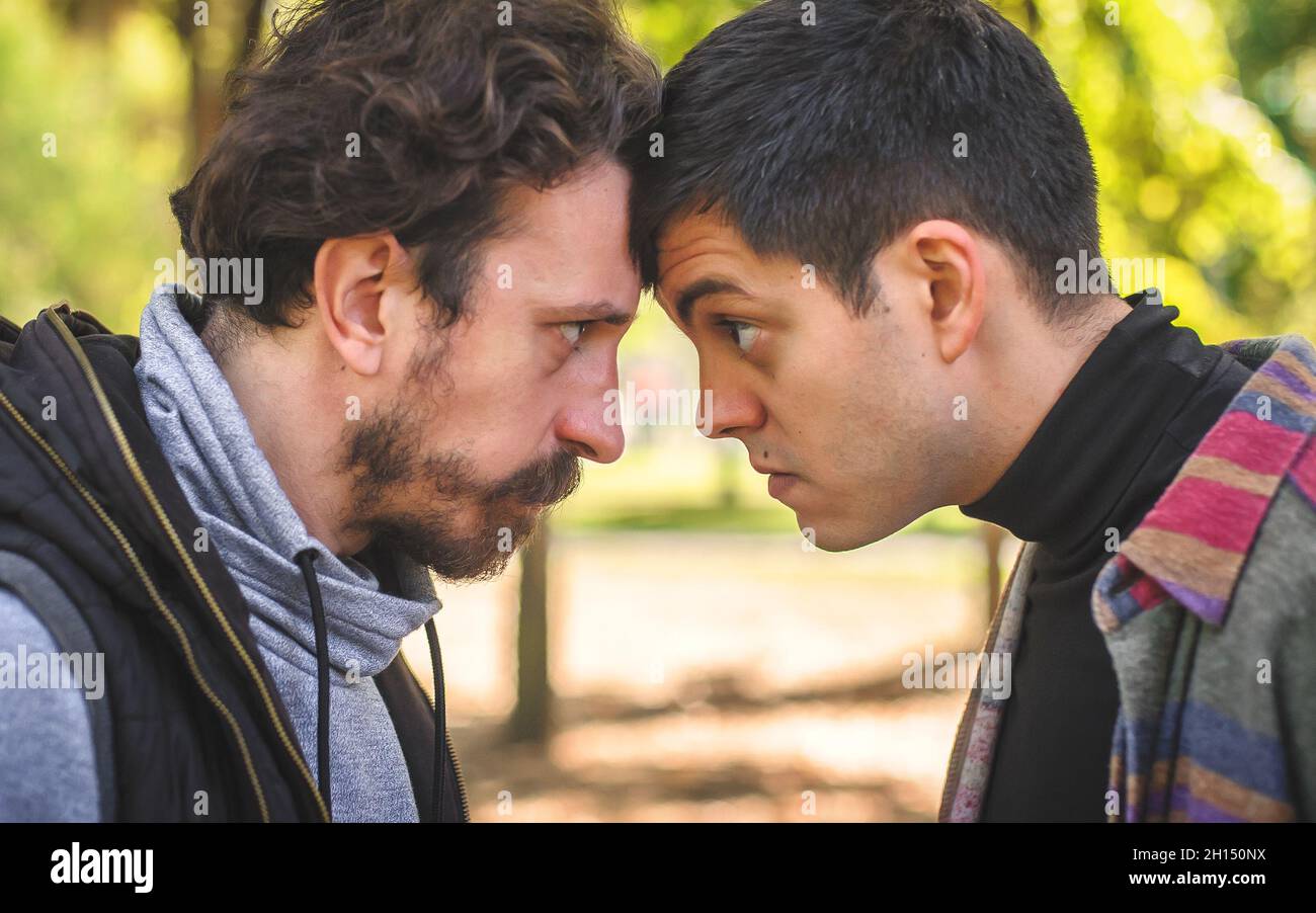 Head to head conflict close-up. Two very angry, nervous and upset men ...