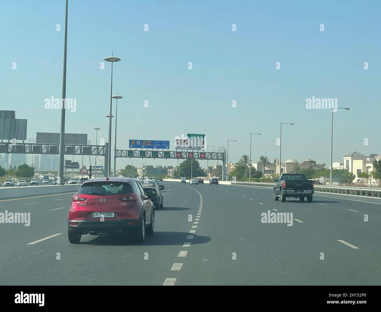Road traffic at financial center in Doha - Lusail road with the Public ...