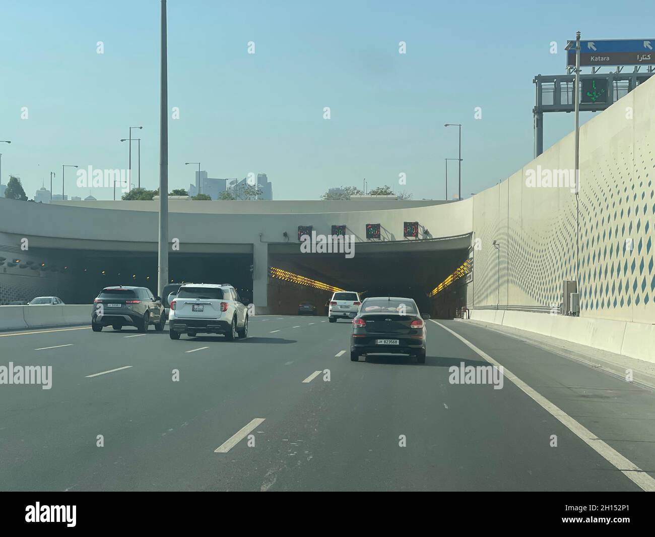 Road traffic at financial center in Doha - Lusail road with the Public ...