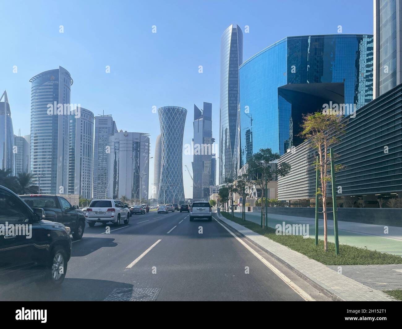 Road traffic at financial center in Doha - Lusail road with the Public ...