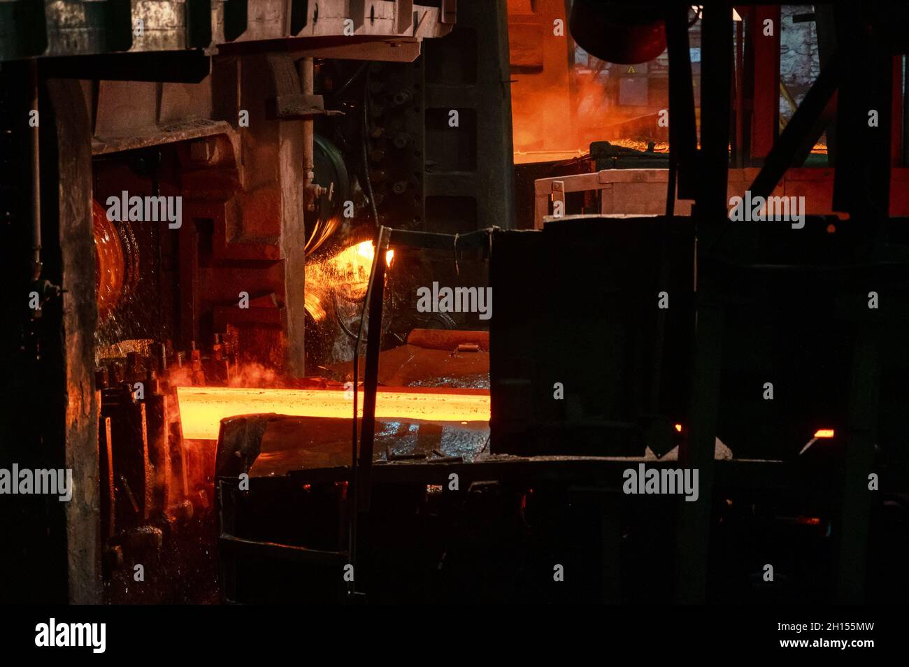 The process of rolling hot rolled steel in a rolling mill Stock Photo ...
