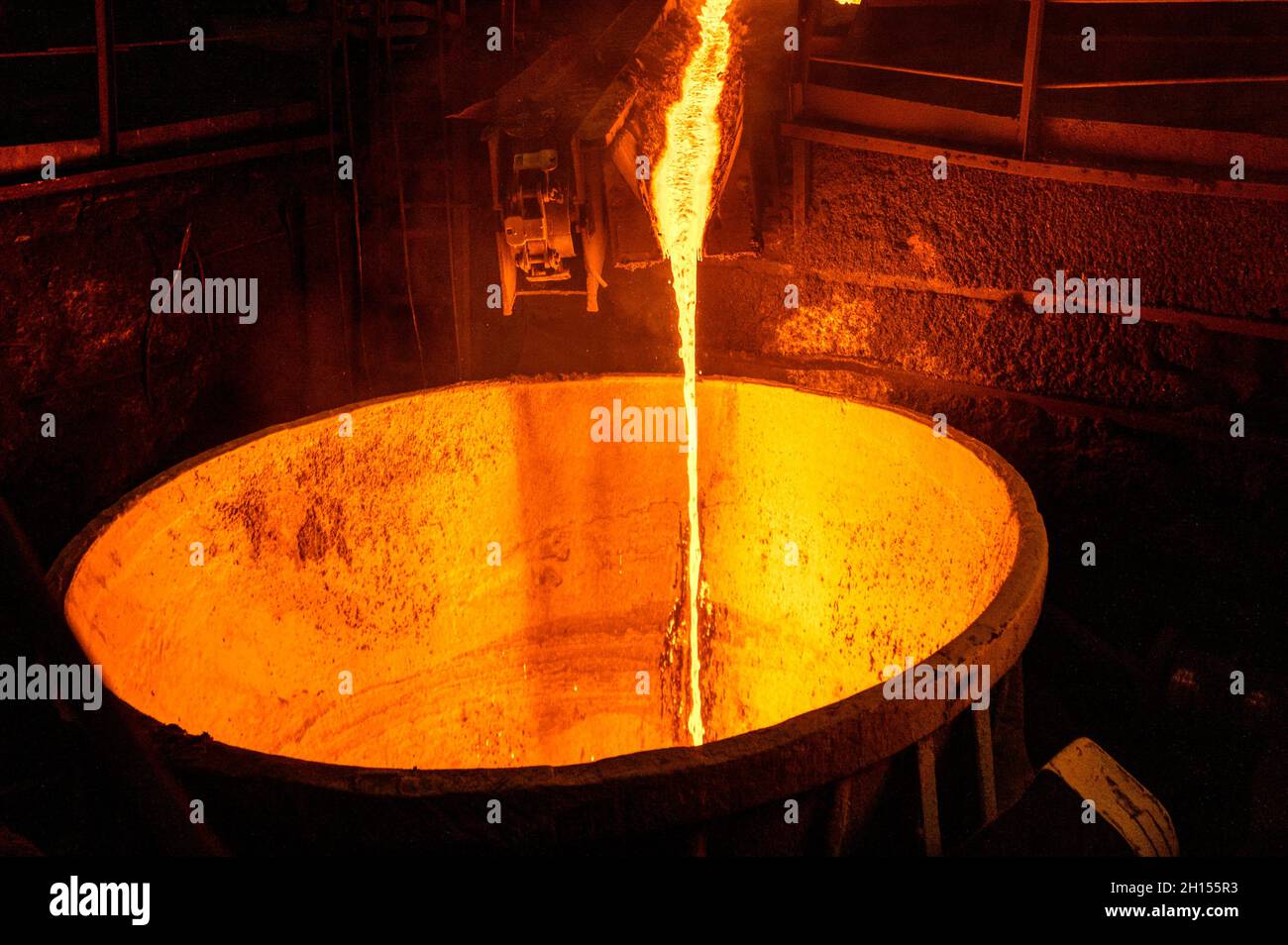 Blast furnace slag tapping. The molten slag is poured into a ladle ...