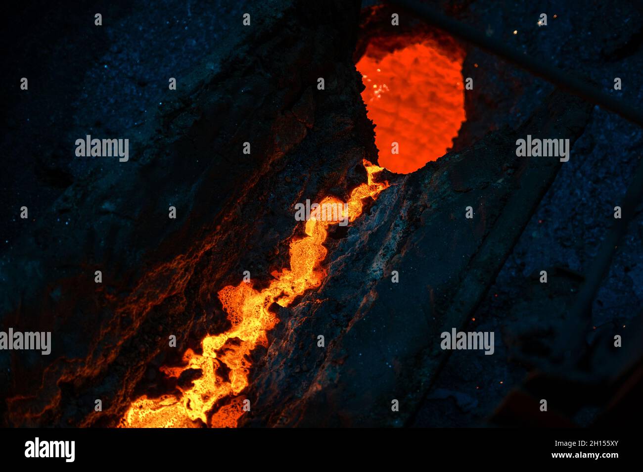 The hot inner surface of the metallurgical ladle. A hole in a thick ...