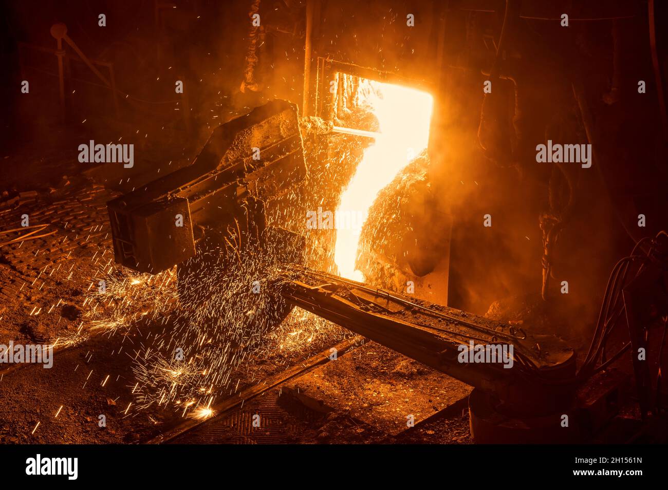 Automatic sampler. The process of taking a sample of liquid metal in a ...