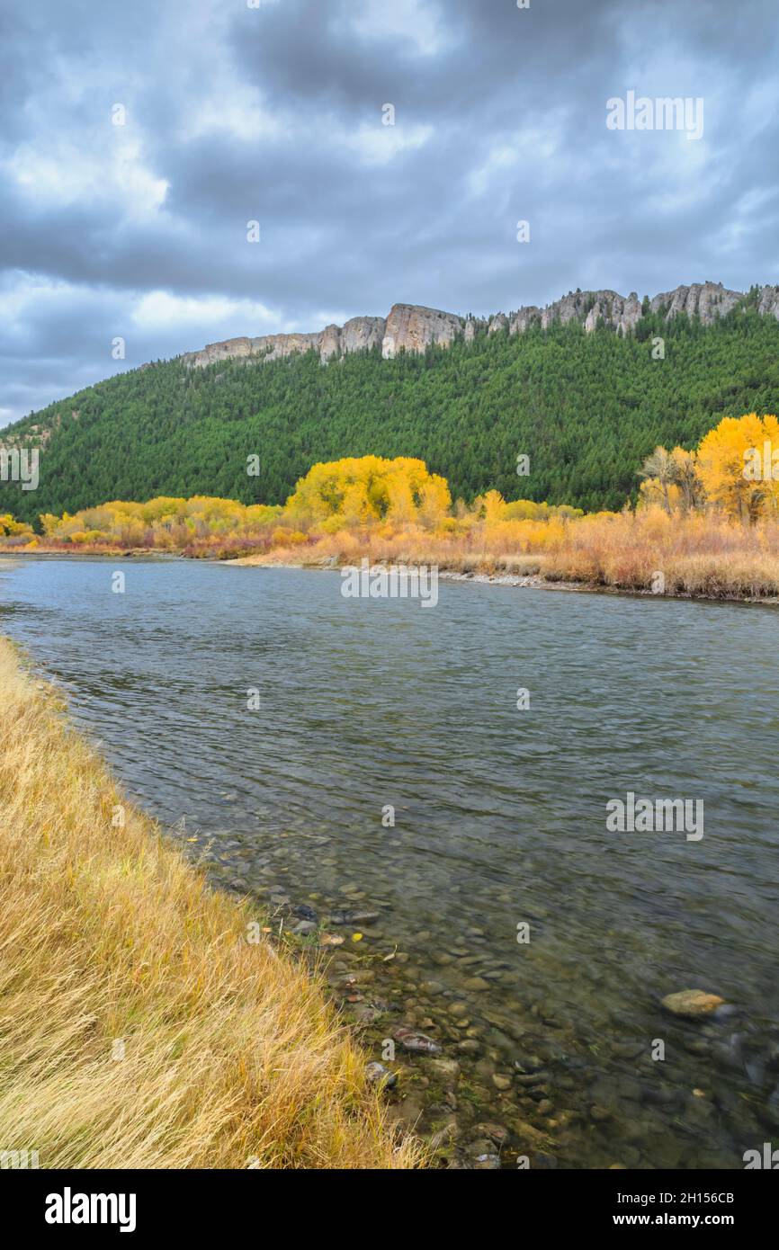 fall colors and cliffs along the clark fork river near drummond ...