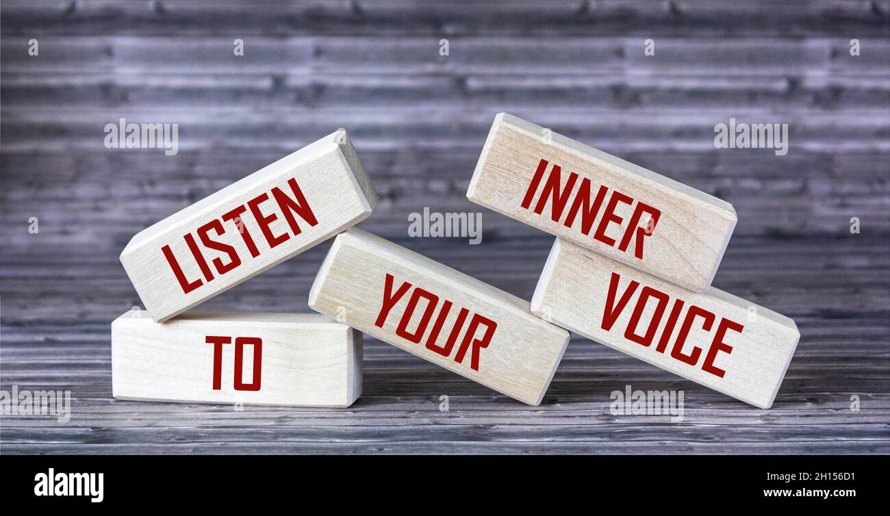 Listen to your inner voice - the text is written on wooden blocks that ...