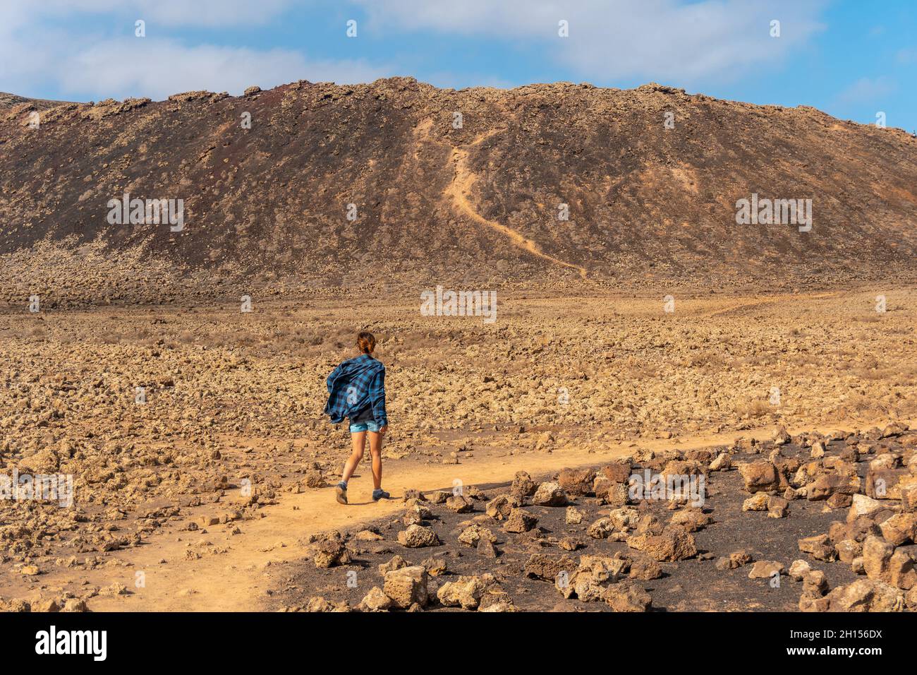 Back view of a woman on the trail to the Crater of the Calderon Hondo ...