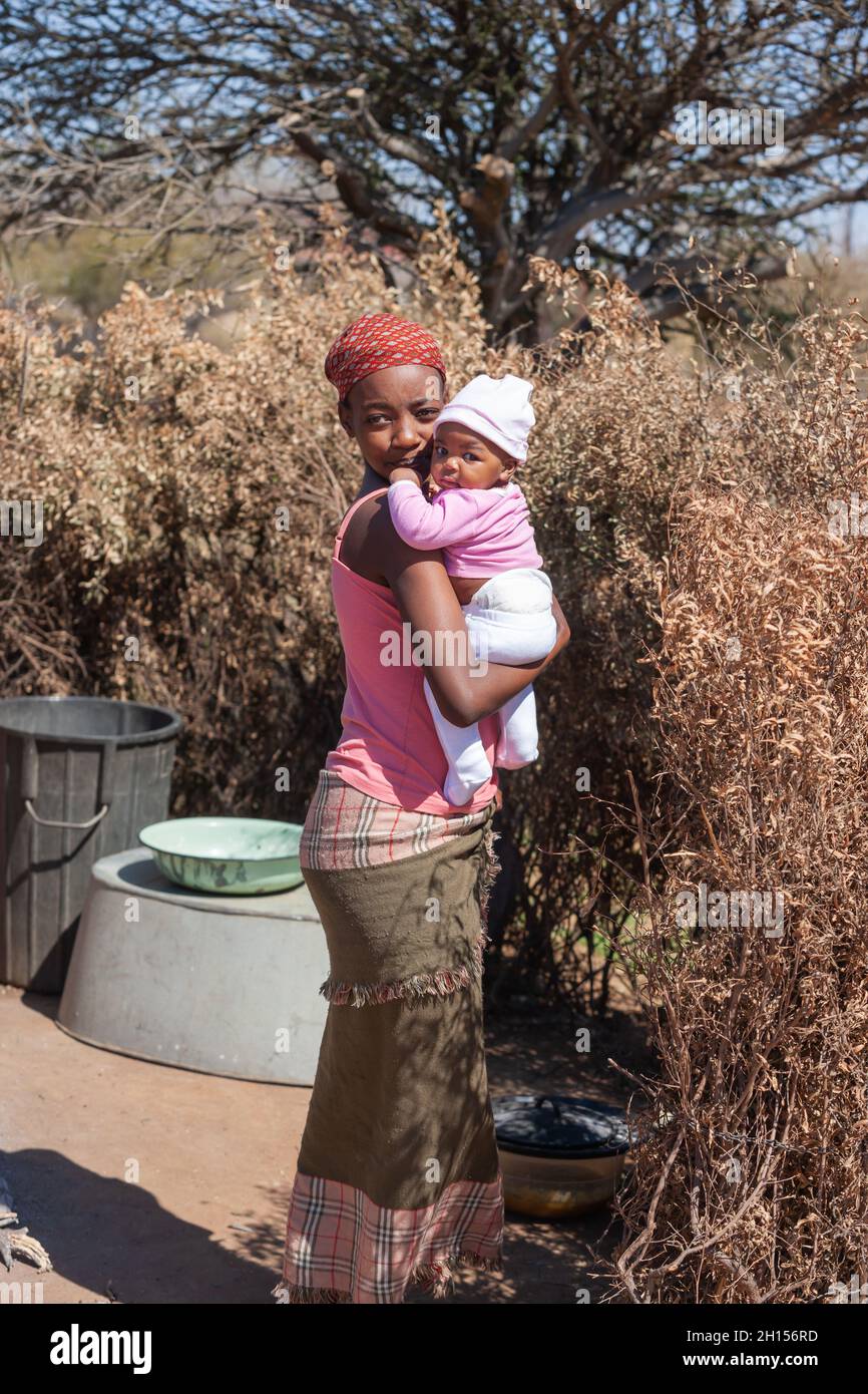Single young African mother in a village in Botswana, the drama of ...