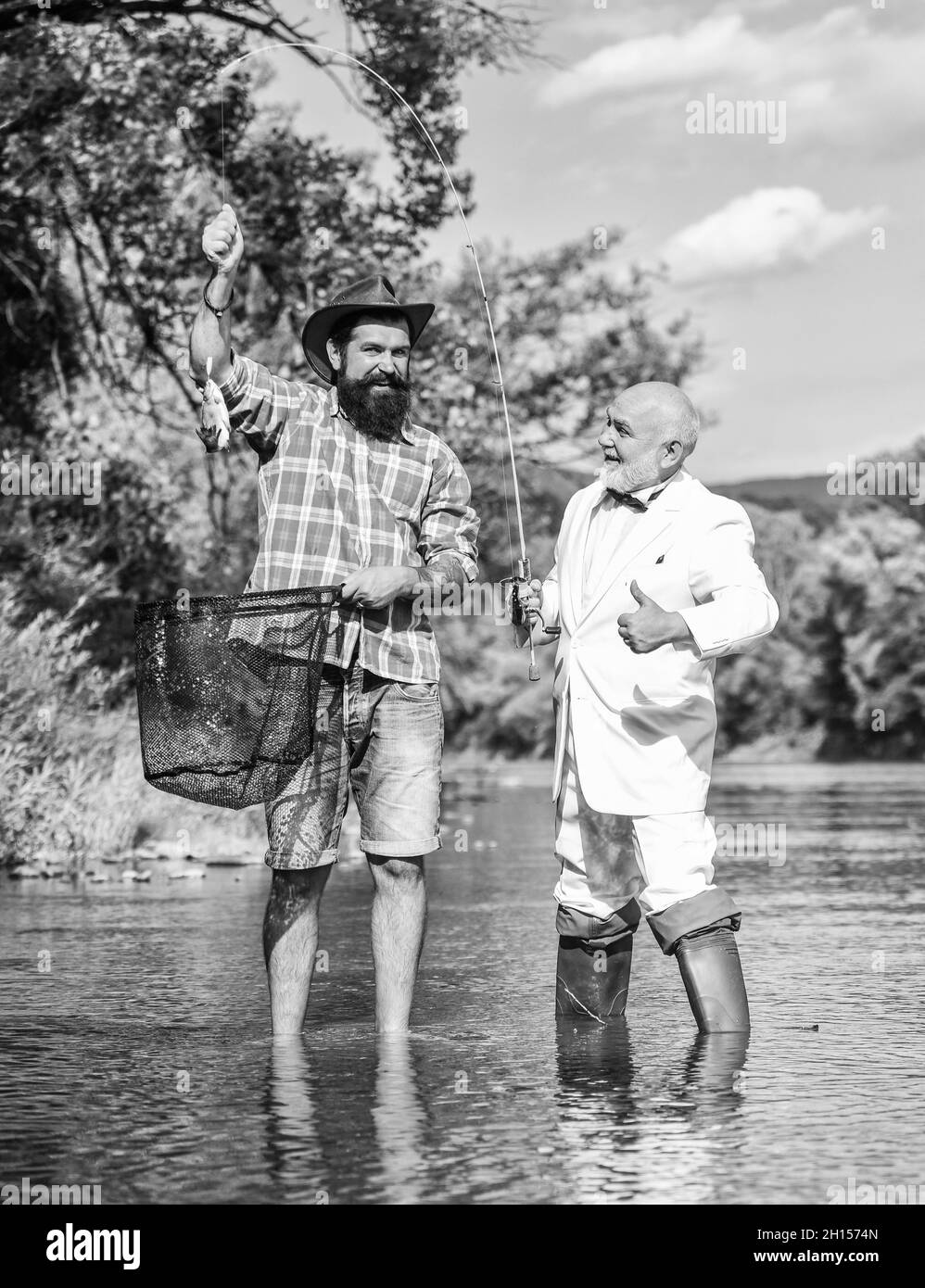 Fellow fishermen. Good catch. Bearded men fishing. Family day. Hobby ...