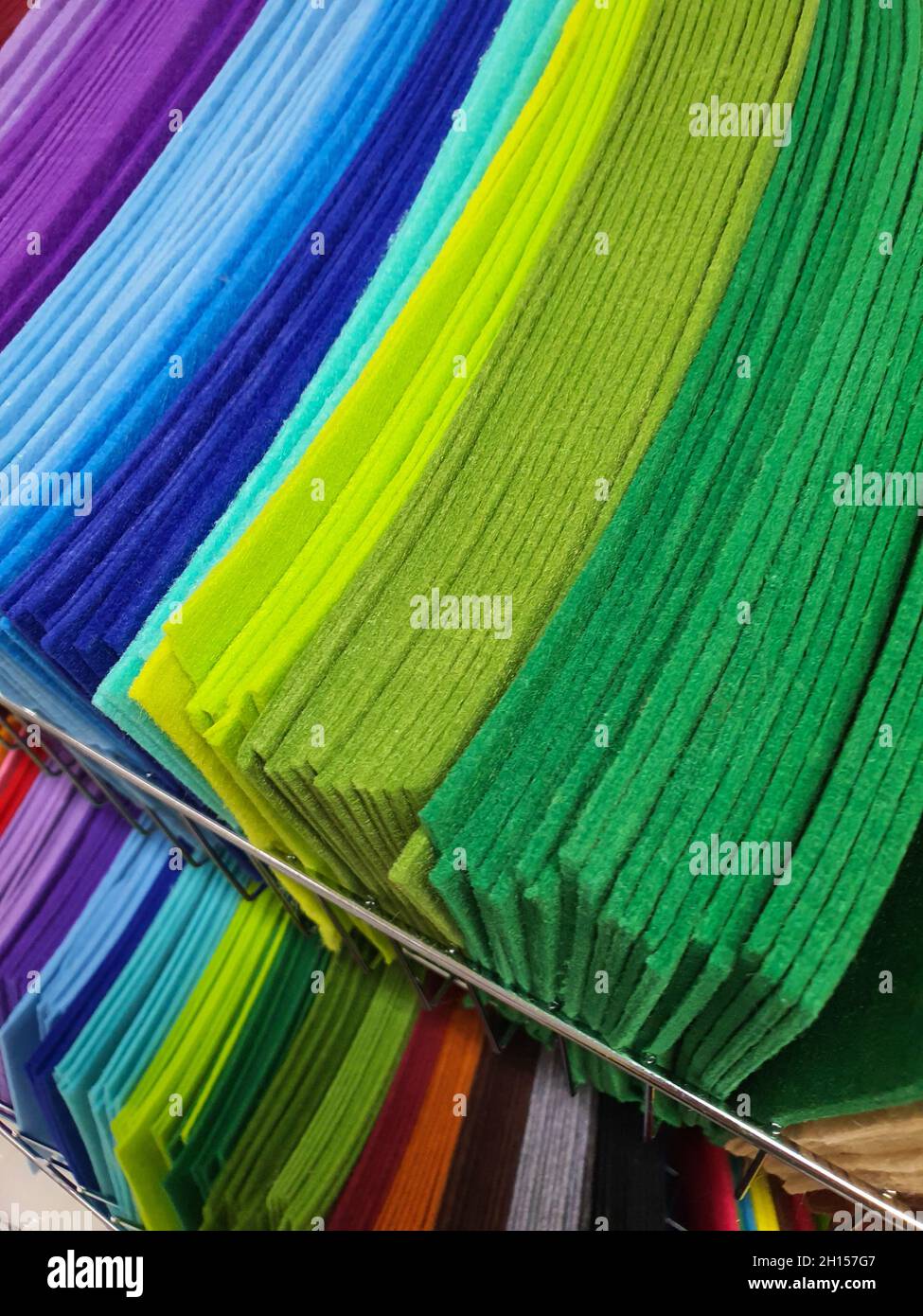 Pieces of colorful textile, samples of felt in different color for ...