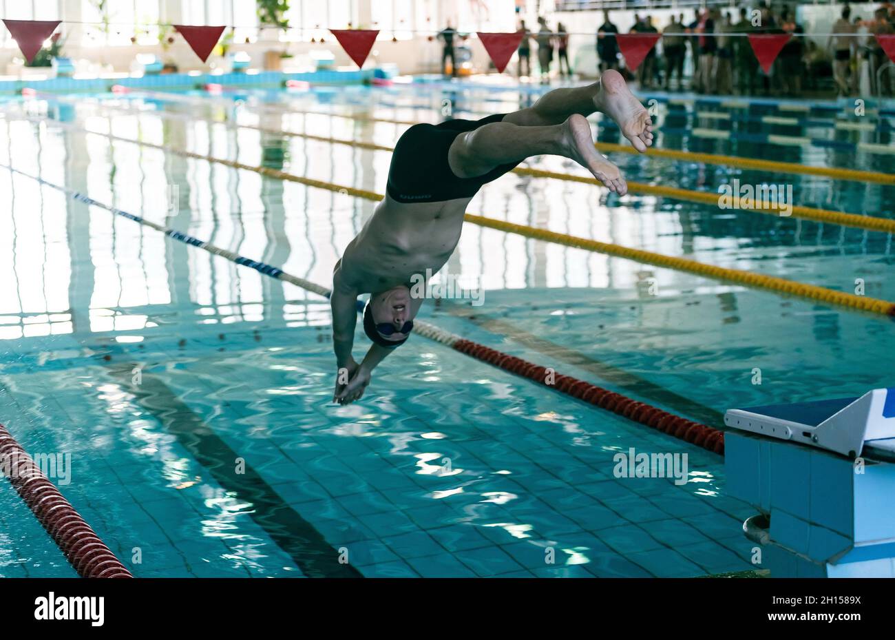 Moscow, Russia. 19th Apr, 2019. A swimmer is seen diving during the ...