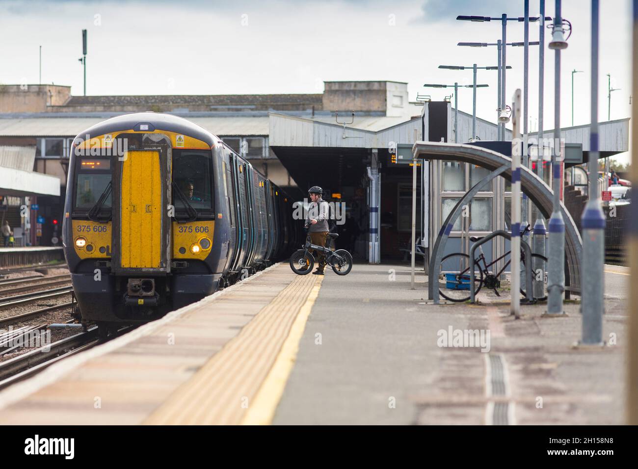 A Southeastern train arrives at Tonbridge station and a passenger with ...