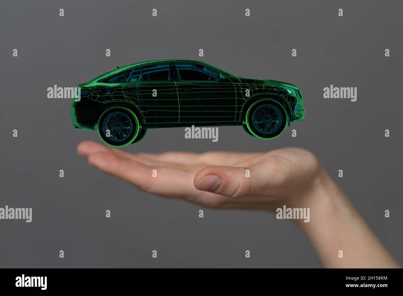 3D rendering of an electric car for autonomous driving and human hand ...