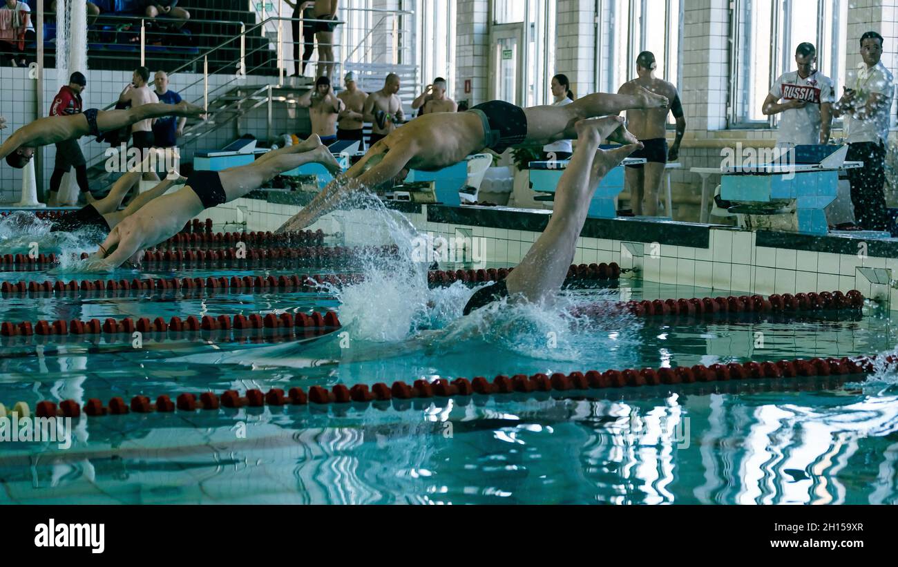 A swimmers are seen diving during the festival. The swimming pool of ...