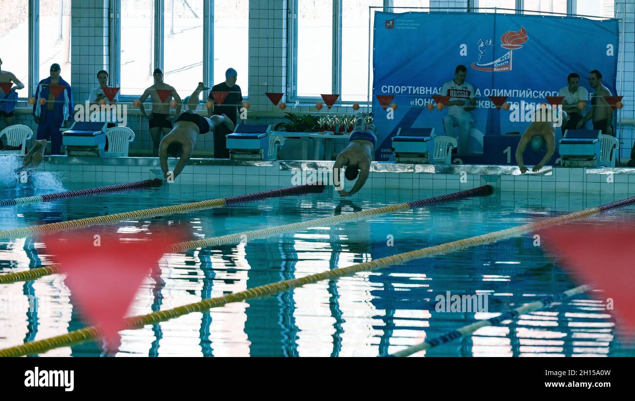 A swimmers are seen diving during the festival. The swimming pool of ...