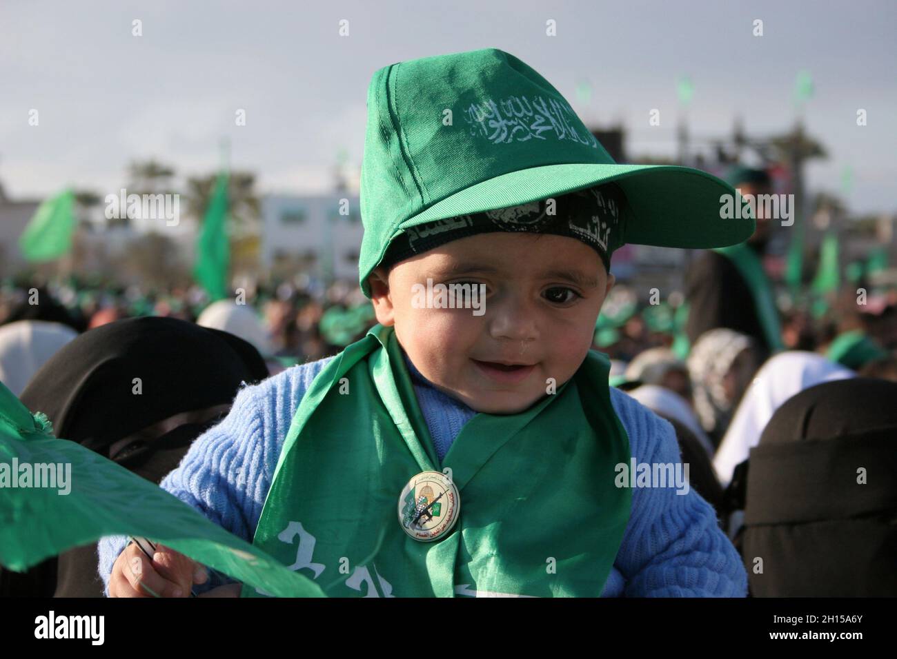 A portrait of a smiling a child at a protest. Gaza Strip, Palestine ...