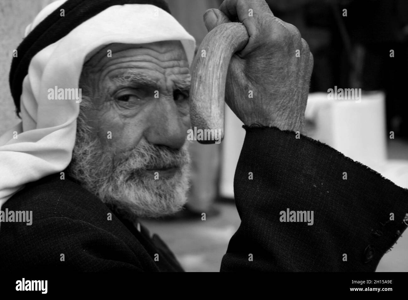 A portrait of an old man who has spent most of his life in a war zone ...