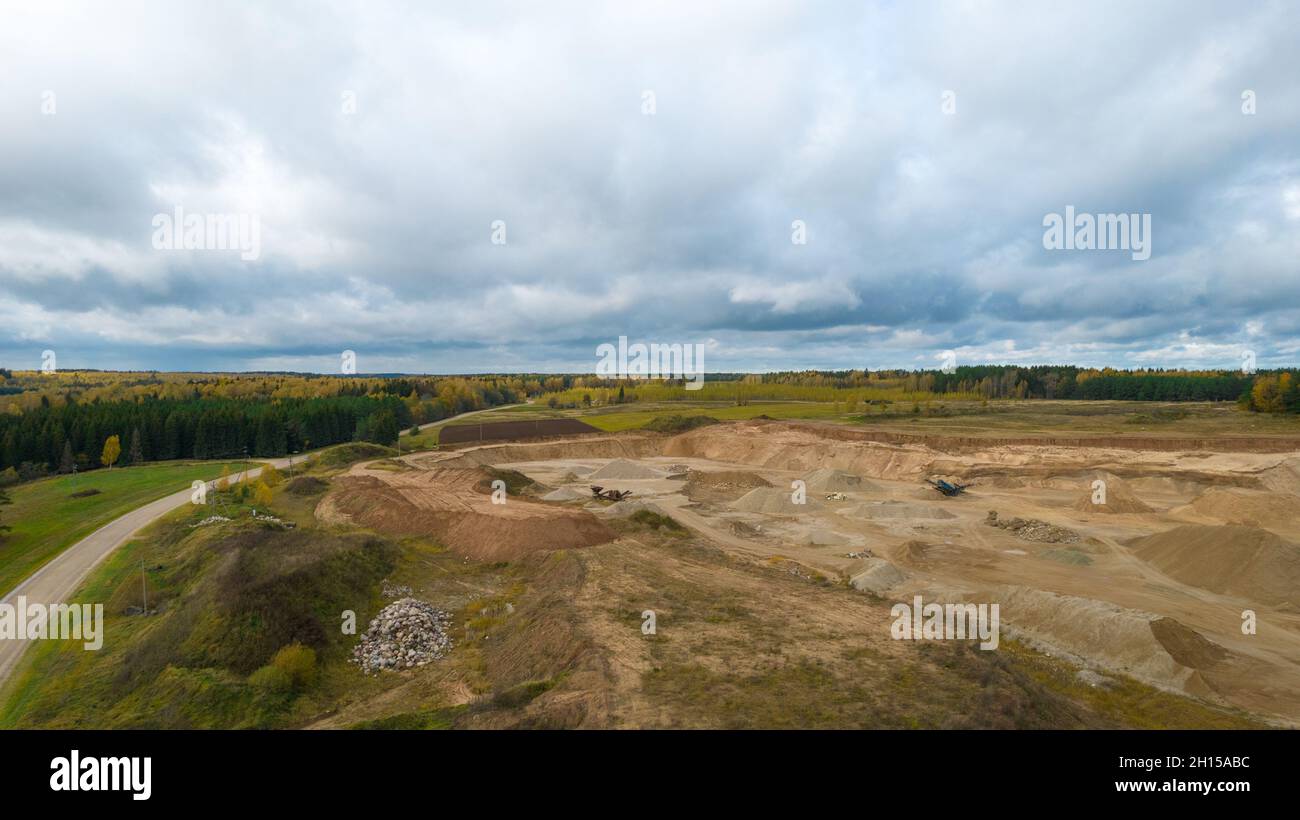 Open pit gravel mining. Large piles of construction sand and gravel ...