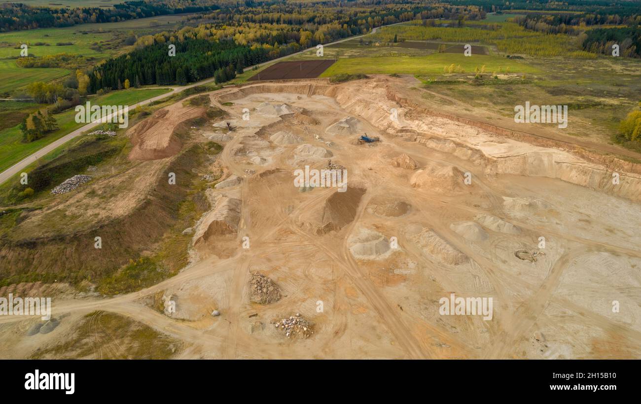 Open pit gravel mining. Large piles of construction sand and gravel ...